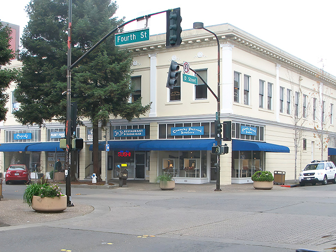This classic corner building houses one of Santa Rosa's beloved local businesses, where blue awnings signal a welcoming spot to pause during downtown explorations.