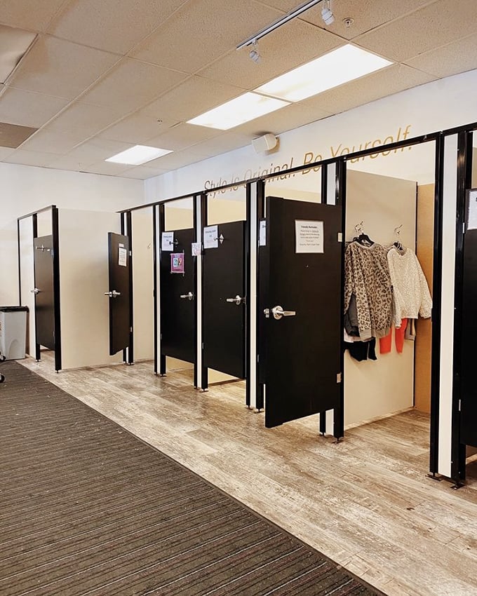 "Style is Original. Be Yourself." The fitting room area offers privacy and inspiration for your fashion metamorphosis.