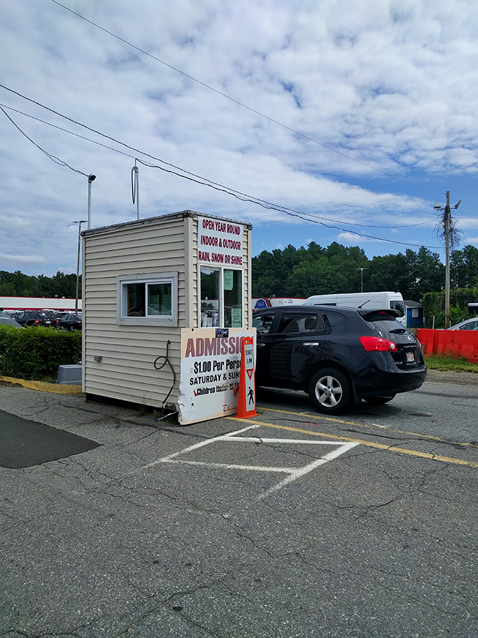 The modest admission booth announces the bargain price of entry&mdash;just a single dollar for adults, with children under 12 entering free.