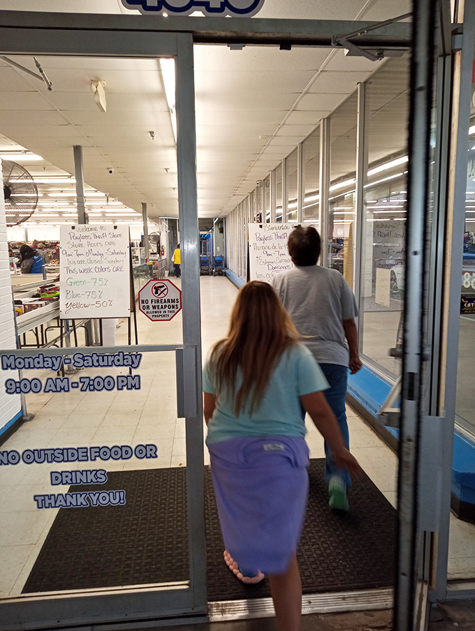 The threshold to treasure hunting. That sign with color-coded discounts is the Rosetta Stone of serious thrifters.