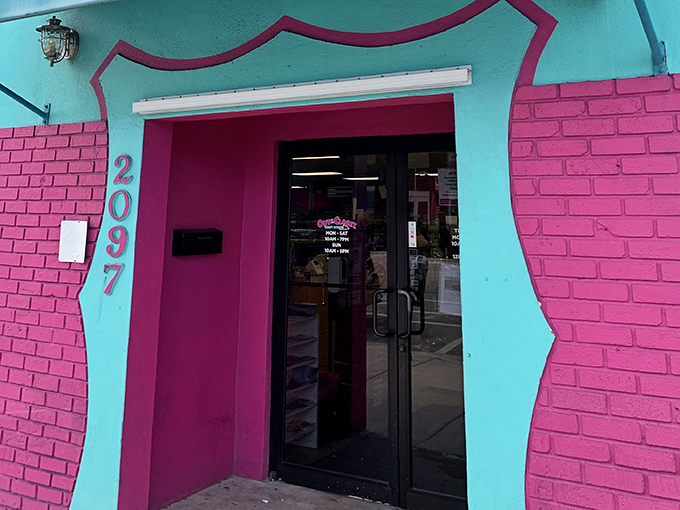 Step through this portal to thrifting paradise. The hot pink entrance isn't just a door—it's an invitation to treasure hunting.