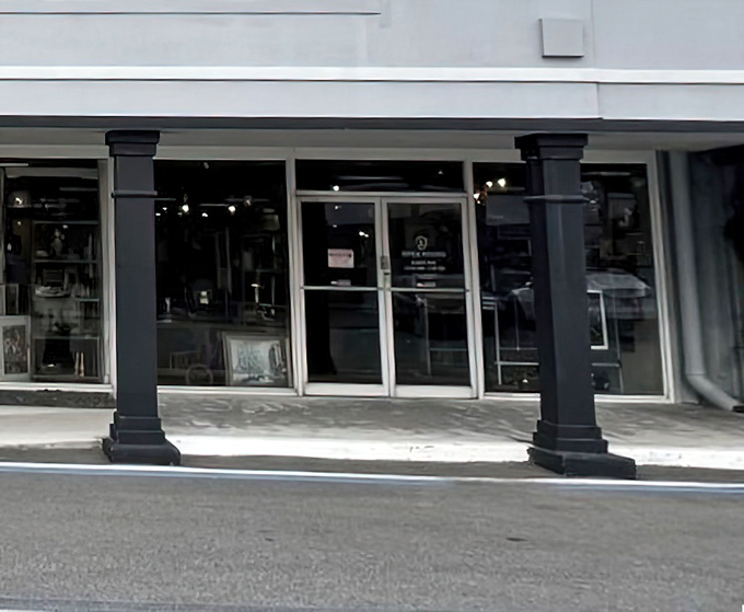 The entrance beckons with the promise of discovery. Those black columns aren't just holding up the roof—they're portals to decades past.