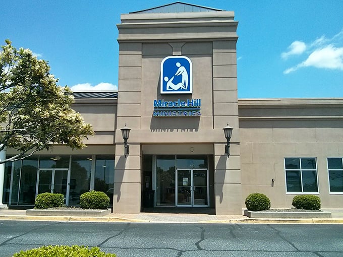 A welcoming entrance flanked by manicured shrubs invites shoppers to begin their treasure-hunting adventure in this Pleasantburg Drive gem.