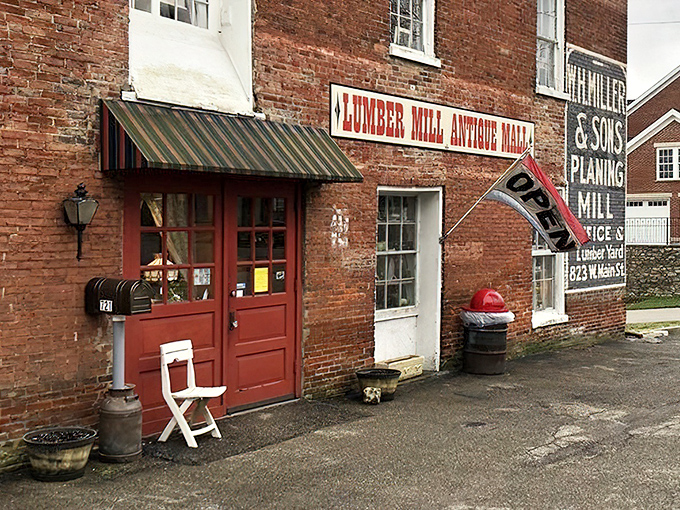 Those red doors might as well be a portal to the past. The humble wooden chair outside says, "Take a load off, the history inside is heavy." 
