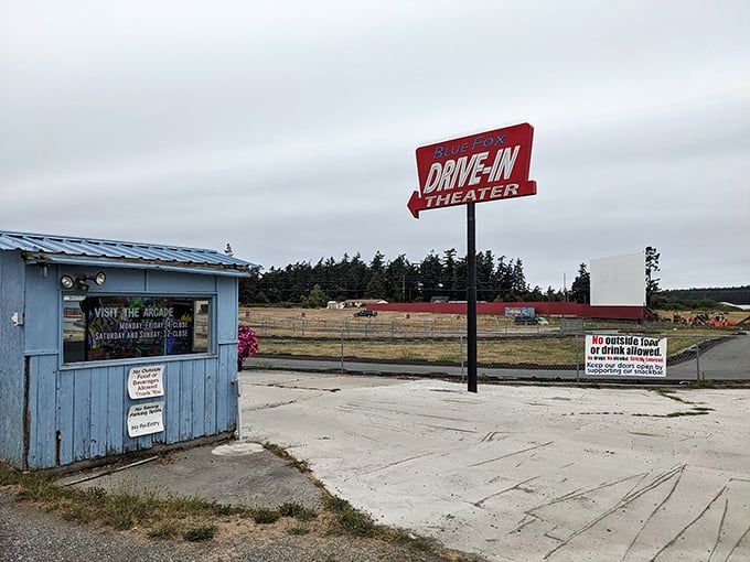 That iconic red sign beckons travelers like a lighthouse for movie lovers navigating Whidbey Island's scenic roads.