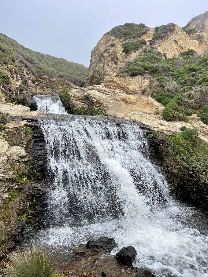 The upper falls offer their own magic, a series of stepped cascades that serve as a perfect appetizer before the main event.