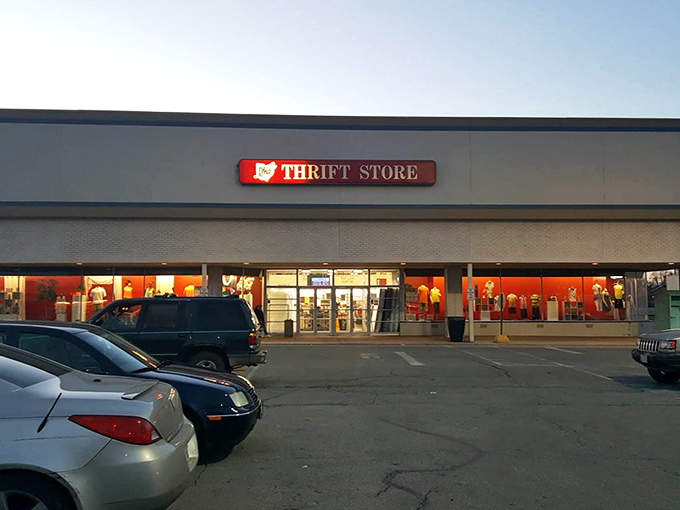 Dusk at the thrift store transforms the ordinary into something magical, with warm light spilling onto the pavement like an invitation to adventure.