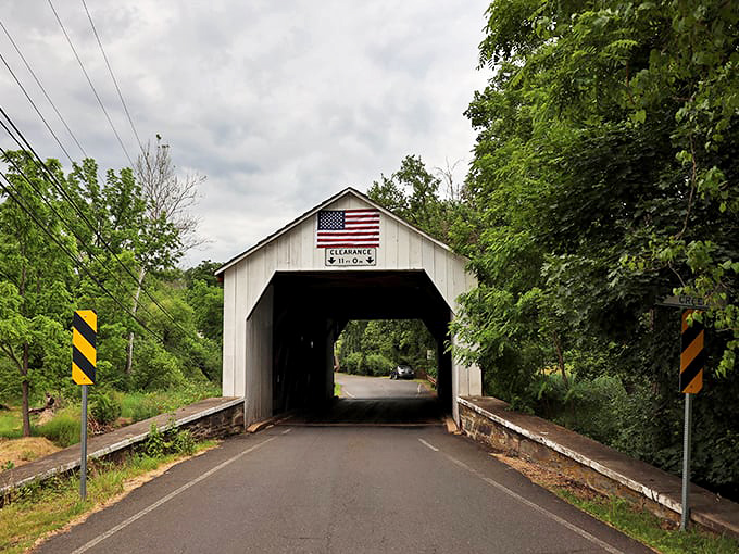 Classic white portals and vibrant red siding create that quintessential covered bridge look. It's the architectural equivalent of comfort food&mdash;familiar, satisfying, and always welcome.