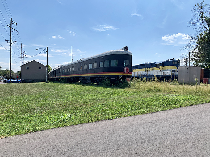 The collection of vintage rail cars stretches across the grounds like chapters in Missouri's transportation story waiting to be explored.