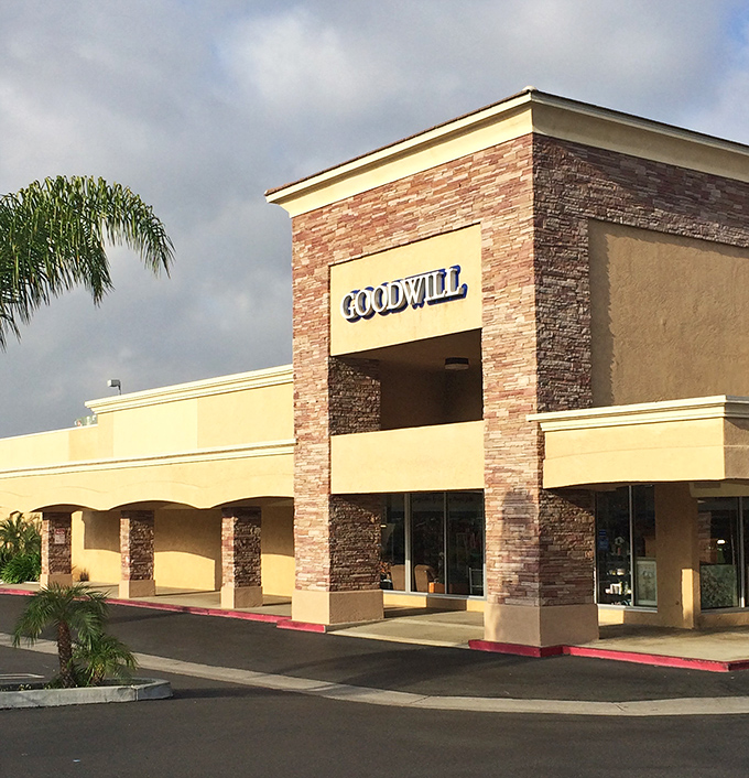 Architectural ambition meets thrift store practicality with this impressive entrance. Who says bargain hunting can't happen in style?
