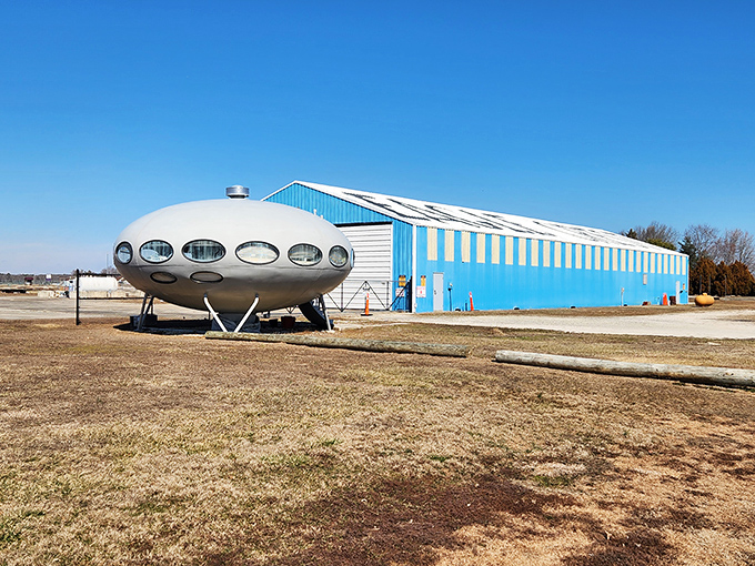 Parked beside a bright blue hangar, this space-age relic looks ready for takeoff. The Jetsons would feel right at home in this orbital abode.