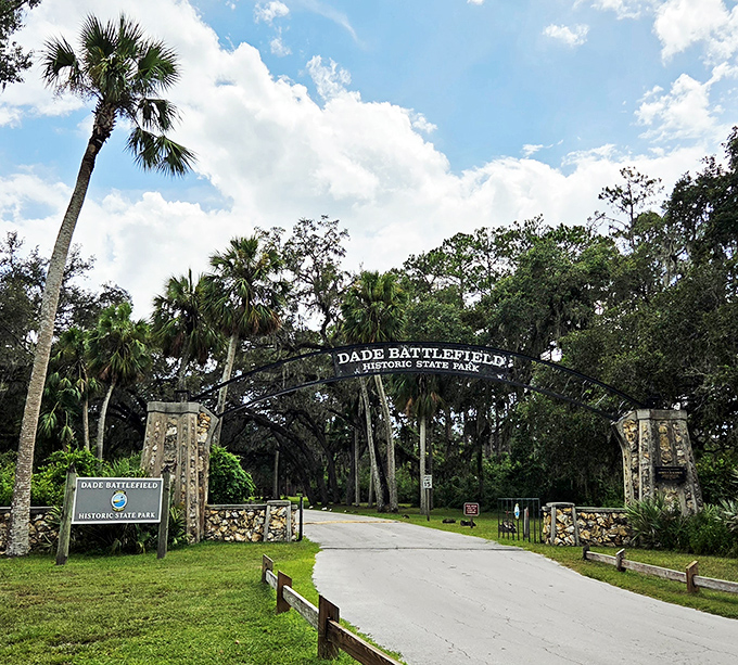 The grand entrance beckons with its stone pillars and wrought iron arch &ndash; like stepping through a portal where modern stress dissolves into historical serenity.