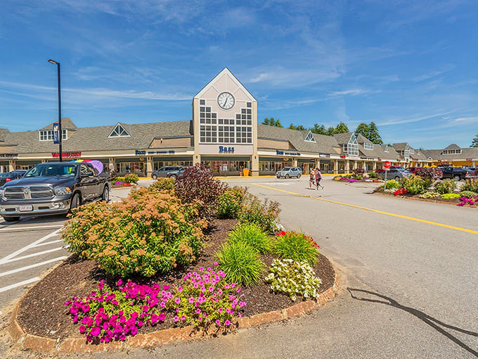 The clock tower presides over this shopping kingdom, where colorful flower beds soften all that asphalt ambition beautifully.