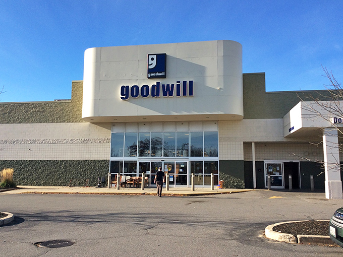 Blue skies frame this temple of thrift where Maine's practical sensibility meets the thrill of the hunt. The curved fa&ccedil;ade promises adventure within.