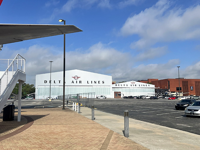 Classic aviation architecture at its finest. These gleaming white hangars house more history than your grandpa's stories about walking uphill both ways. 