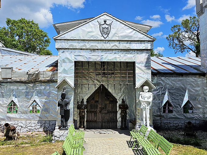The grand entrance beckons visitors with whimsical metal guardians and the promise of artistic treasures within. Medieval meets recycling in the most delightful way.