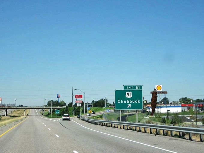 That iconic green highway sign&mdash;less a destination marker, more an invitation to a simpler way of life where your retirement dollars stretch like saltwater taffy.