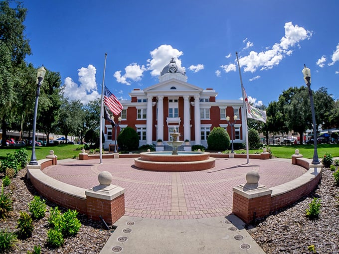 Stately columns and American flags frame the Pasco County Courthouse, where small-town democracy happens without the drama of cable news.