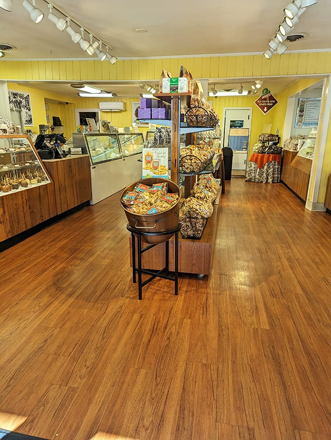 A cozy candy haven where caramel, chocolate, and popcorn tempt you from every corner of this cheerful shop.