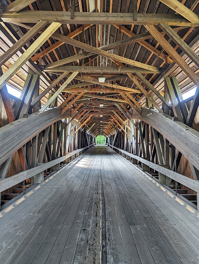 Step inside and marvel at the intricate lattice truss design&mdash;a cathedral of timber where sunlight plays between centuries-old beams.