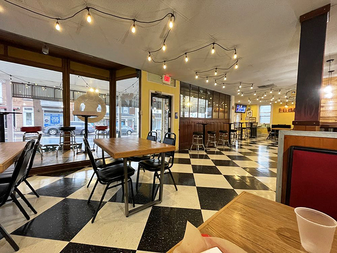 The black and white checkered floor says "classic diner," but those string lights overhead whisper "you're about to have a magical meat experience."