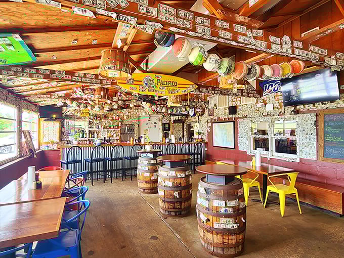 Dollar bills wallpaper the ceiling while barrel tables create the perfect casual vibe. This isn't fine dining&mdash;it's something much better.