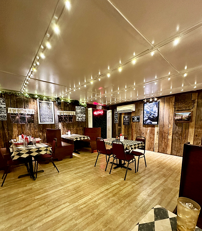 Inside, string lights dance across the ceiling while wood-paneled walls and checkered tablecloths create the perfect backdrop for serious sandwich consumption.