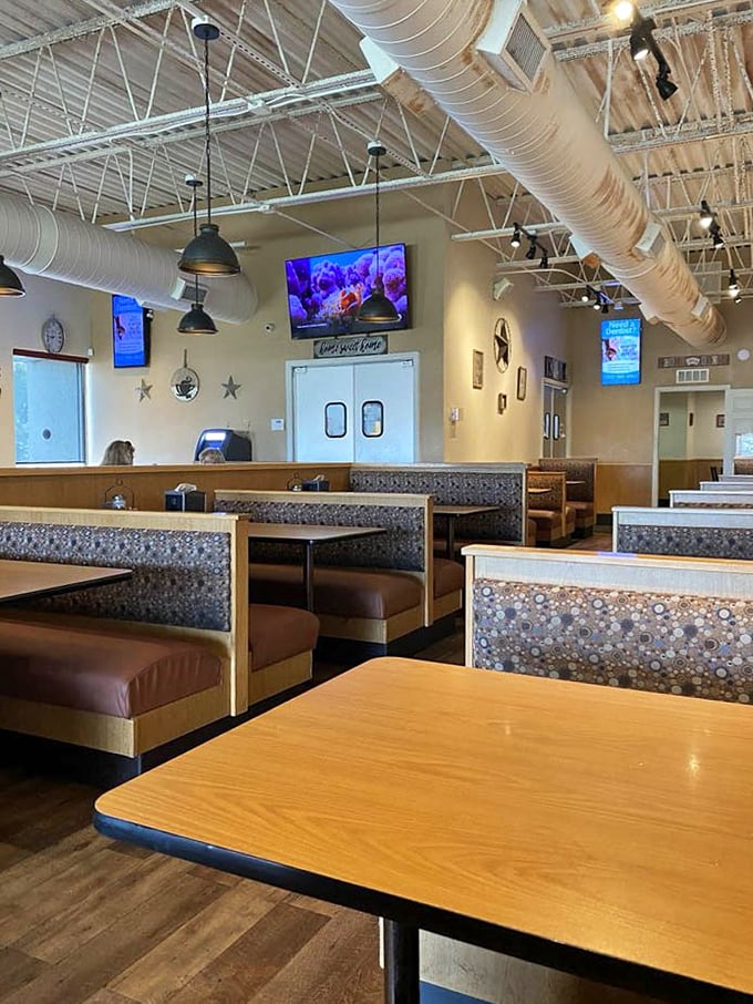 Classic wooden booths and exposed ductwork create that perfect balance of nostalgia and comfort—like your favorite aunt's kitchen got an industrial-chic makeover.