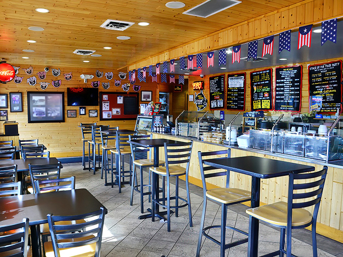 Knotty pine walls and American flags create the perfect backdrop for serious meat meditation. BBQ zen achieved.