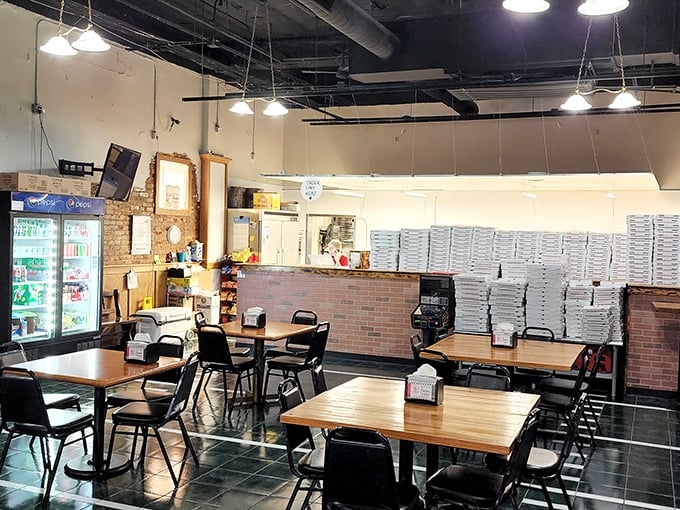 Simple tables, no-nonsense chairs, and stacks of pizza boxes ready for action&mdash;this is a place that puts its energy into the food, not fancy furniture.
