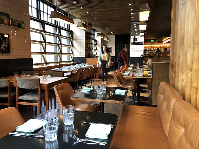 Mid-century modern meets contemporary comfort in this thoughtfully designed dining room. The warm wood tones and leather seating invite you to settle in for the long haul.