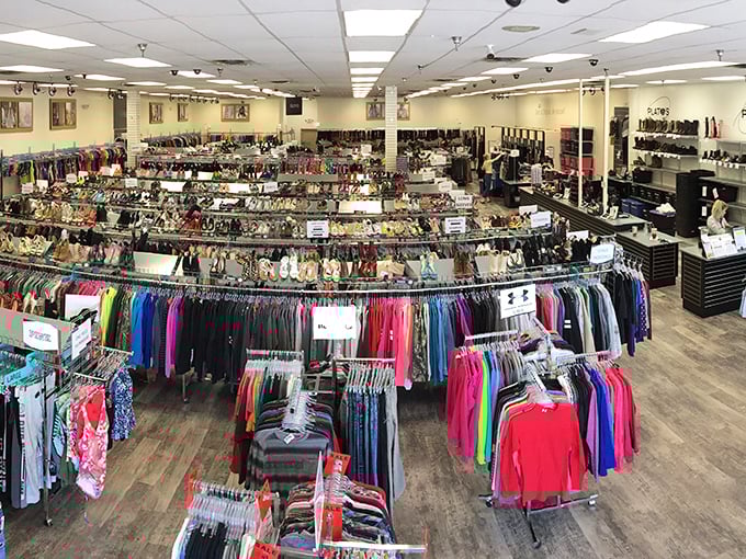 A fashionista's playground where circular racks create a labyrinth of possibilities, organized with a precision that would make Marie Kondo weep with joy.