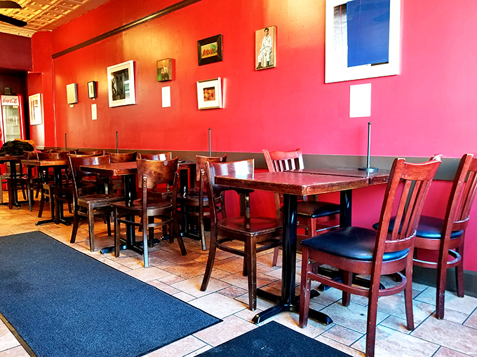 Red walls and wooden tables create the perfect no-nonsense backdrop for the serious business of BBQ consumption. Your focus belongs on the plate anyway.