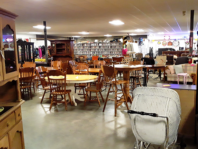 A symphony of wooden chairs and dining tables awaits new homes. Each piece silently wondering what conversations it might host in its next chapter.