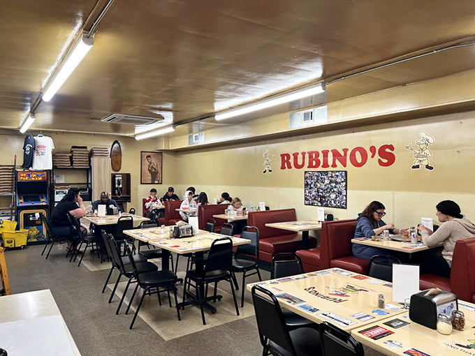 No-frills dining room where conversations matter more than decor. Those red vinyl booths have heard decades of "This is the best pizza I've ever had."