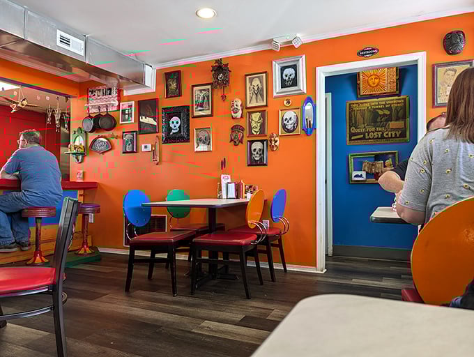 Inside Casper's, the vibrant orange walls serve as a gallery for eclectic art, creating a space that's equal parts diner and delightful fever dream.