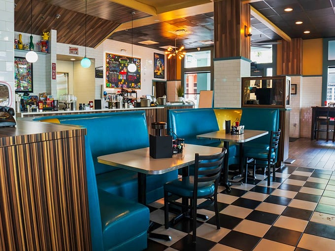 Step inside and the classic diner dream materializes&mdash;turquoise booths, checkerboard floors, and wood accents that whisper, "Stay awhile, calories don't count here."