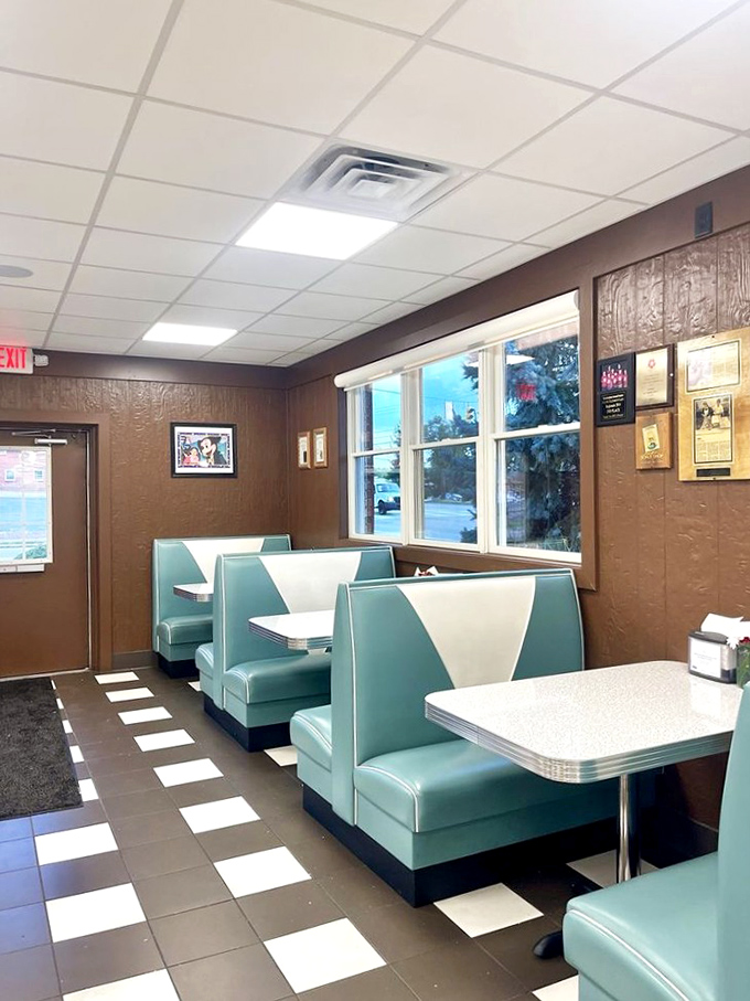 These vintage turquoise booths have witnessed more heartfelt conversations and sugar rushes than a therapist's couch. Classic Americana at its finest.
