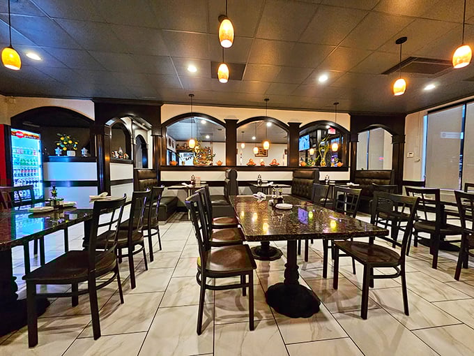 The warm interior combines elegant arches and pendant lighting to create an atmosphere that says "stay awhile" without shouting it.