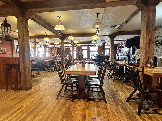 Exposed wooden beams frame the warm, inviting dining room where generations of Kansans have gathered. Those floors have stories to tell&mdash;if only they could talk!