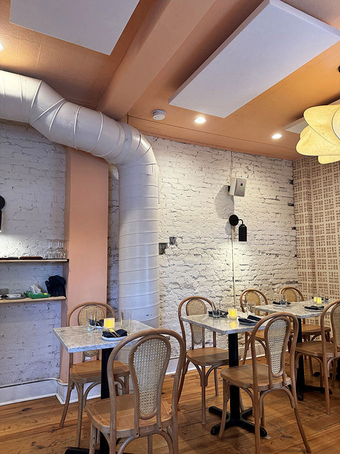 White brick walls and cane-backed chairs create that perfect "why aren't we eating in Italy?" atmosphere. Simplicity that lets the food be the star.