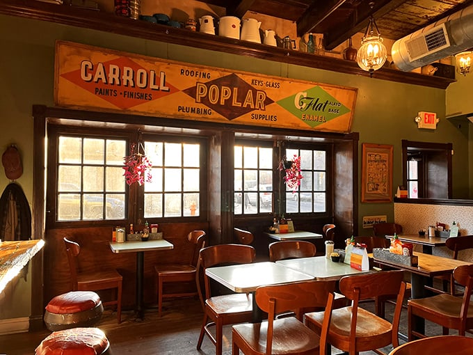 Vintage hardware store signs and warm wooden tables create that rare atmosphere that can't be manufactured&mdash;only accumulated through years of genuine character.