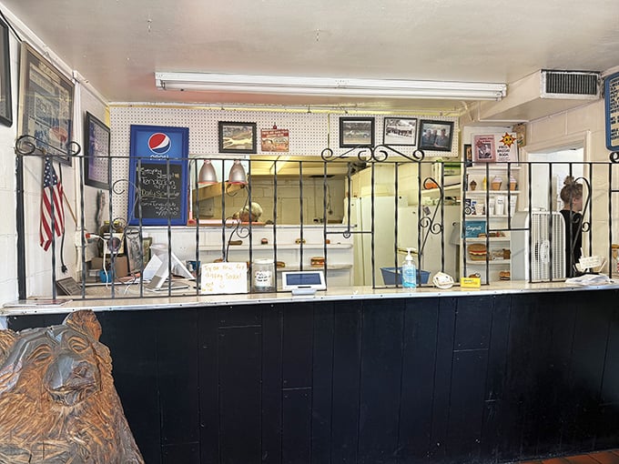 Behind this wrought-iron barrier lies the command center of comfort food dreams, where simplicity reigns and pretension is permanently banned from the premises.