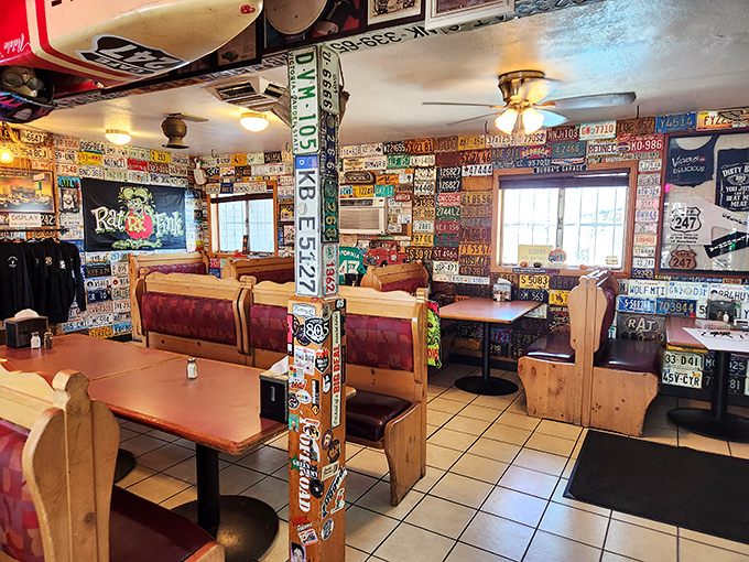 License plate heaven! The interior walls showcase an American road trip history lesson while wooden booths invite you to settle in for comfort food perfection.