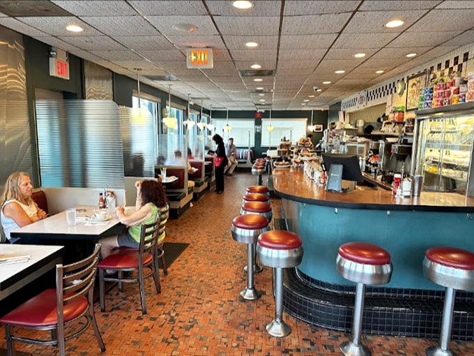 The classic American diner counter &ndash; where strangers become neighbors and the coffee refills flow as freely as the conversation.