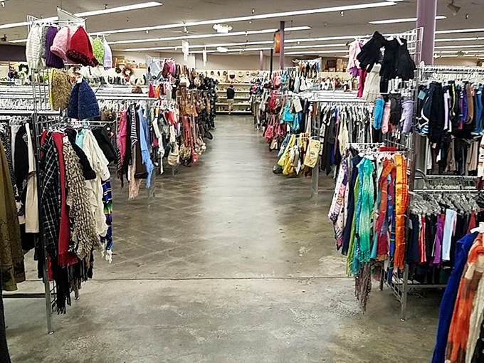Endless racks create a textile labyrinth where fashion time-travelers can hop between decades. The thrill of the hunt begins here!