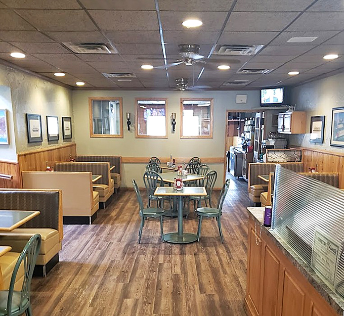 Inside, wood paneling and comfortable booths create that perfect "everybody knows your name" vibe where regulars have been claiming their favorite spots for decades.