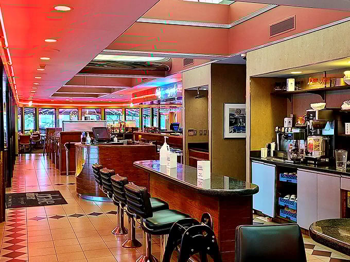 Where nostalgia meets appetite&mdash;classic counter seating invites solo diners to watch culinary magic unfold while red accents warm the space like a culinary hug.