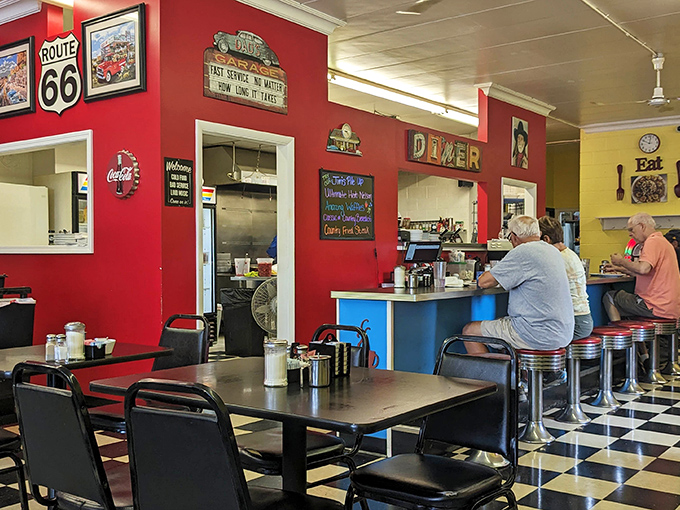 Classic Americana comes alive with vibrant red walls, Route 66 memorabilia, and a counter where regulars have claimed their spots for years.
