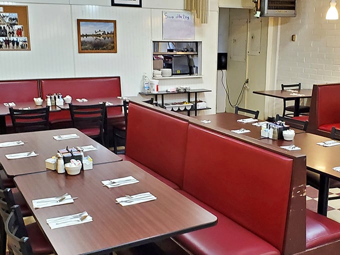 Classic red vinyl booths and no-nonsense tables create that perfect diner atmosphere where comfort food and comfort seating go hand in hand.